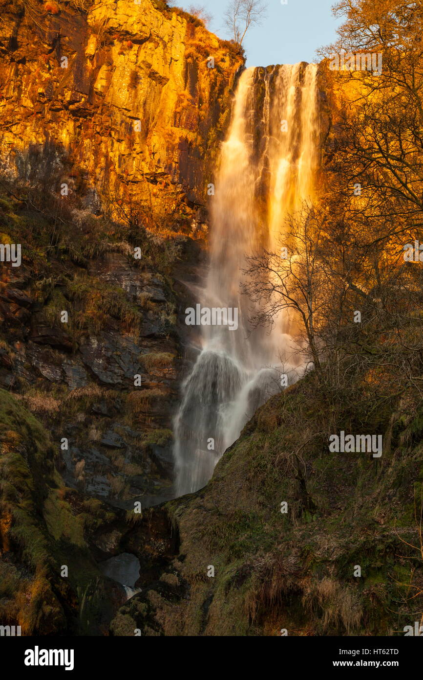 Pistyll Rhaeadr waterfall is bathed in early morning golden light Stock ...