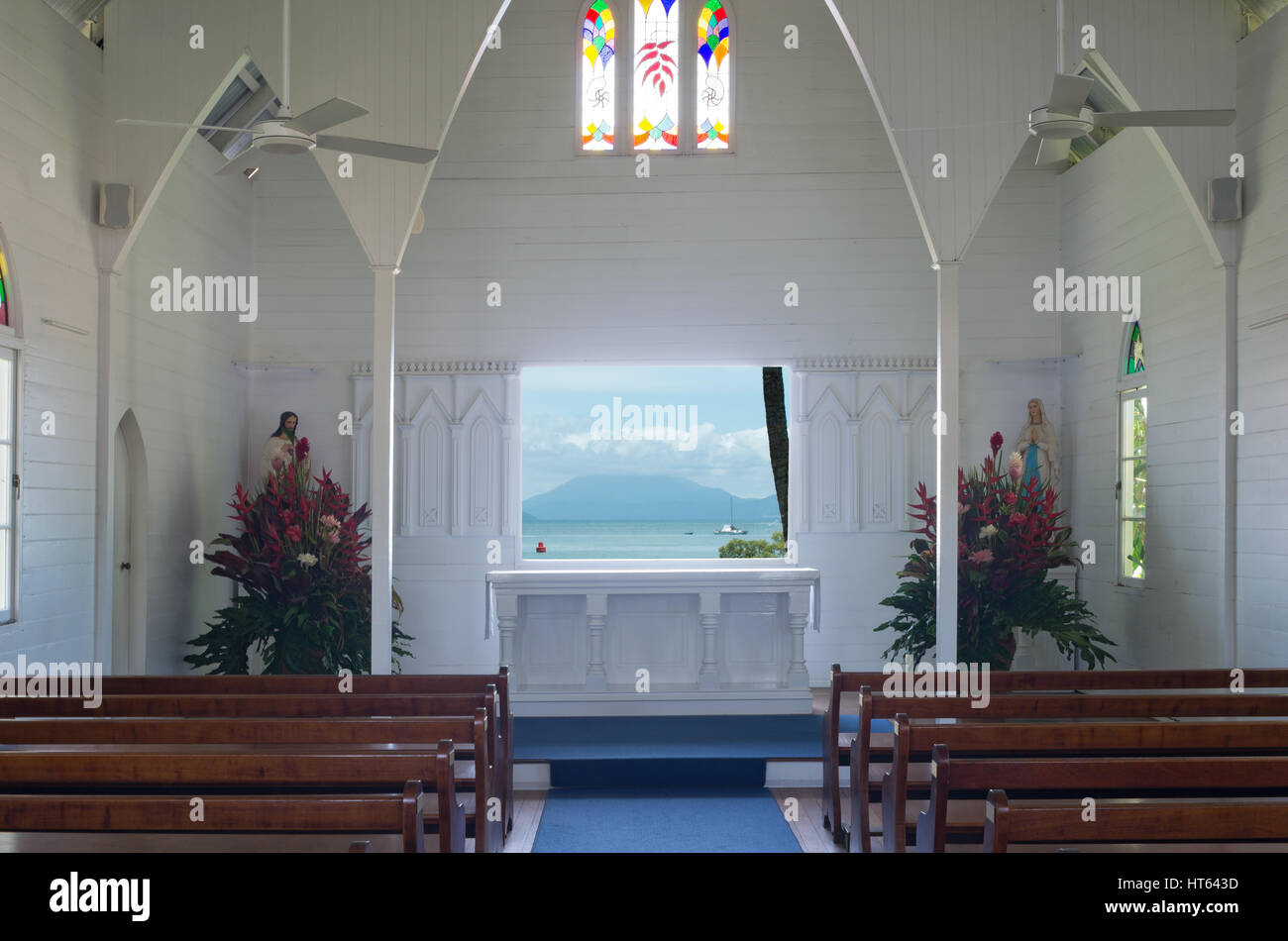 historic non-denominational wedding chapel interior lit by windows with ...