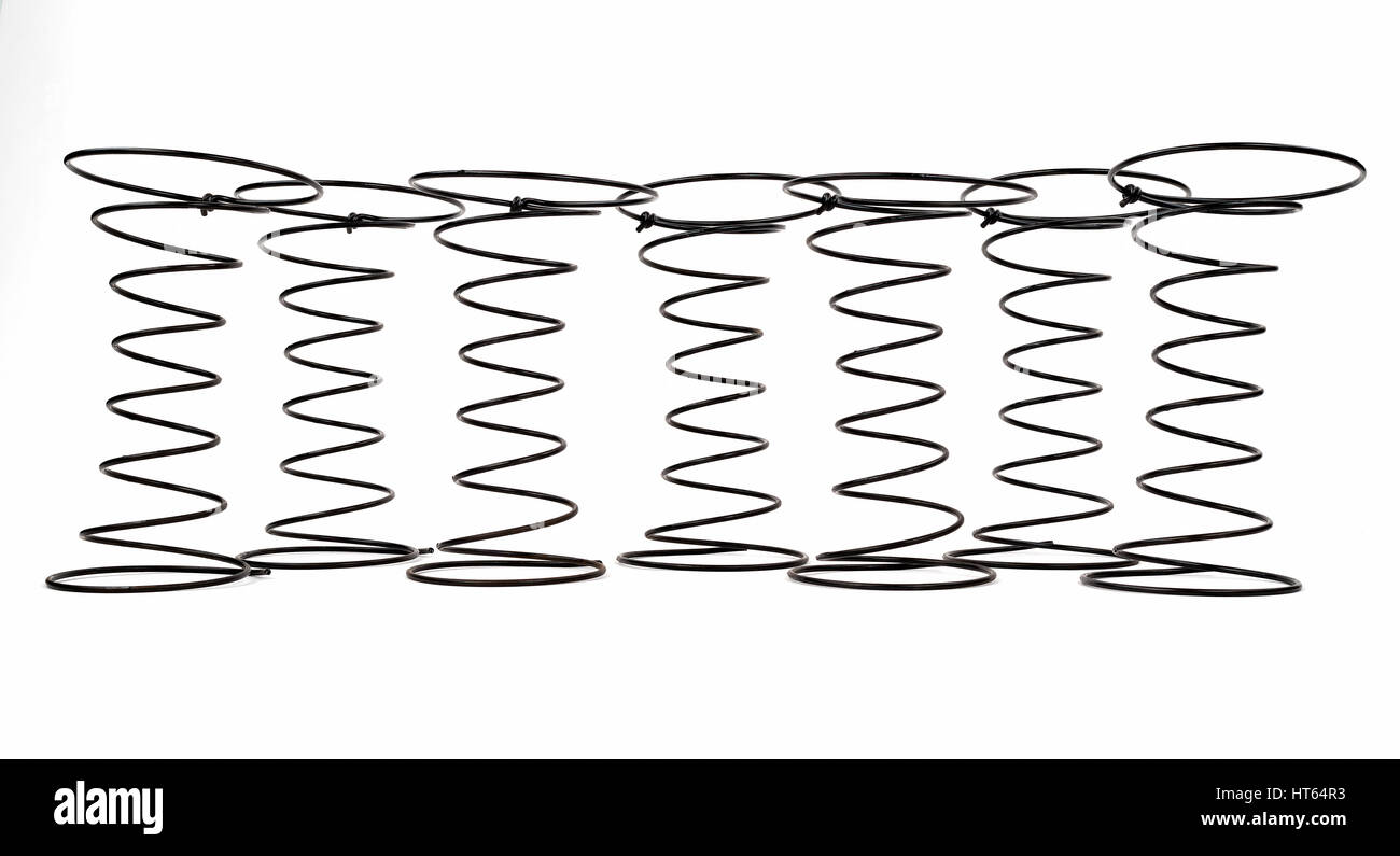 Seven Black Wire Springs used in Upholstery on white background Stock ...