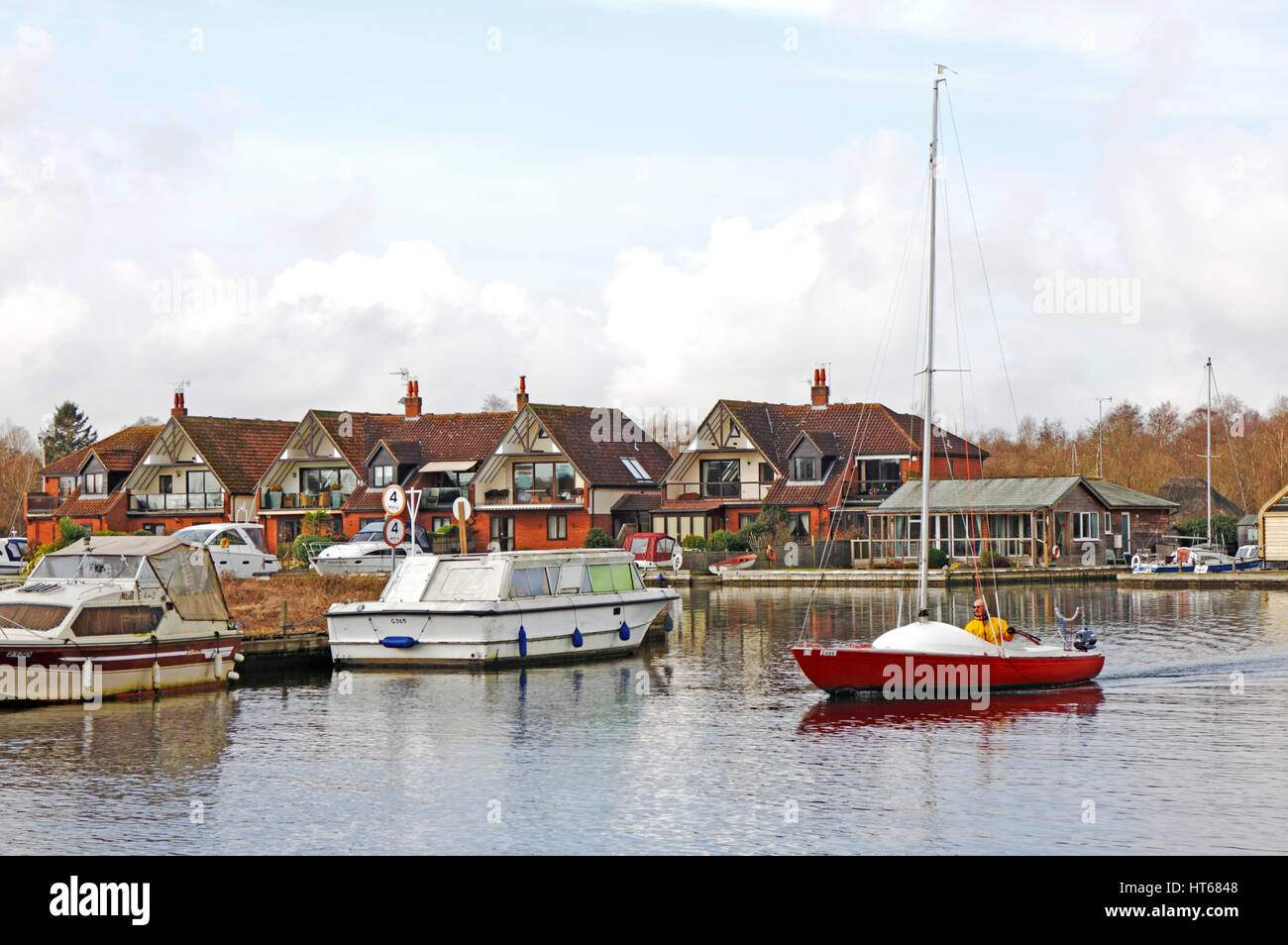 A view of boats on the River Bure on the Norfolk Broads at Horning ...
