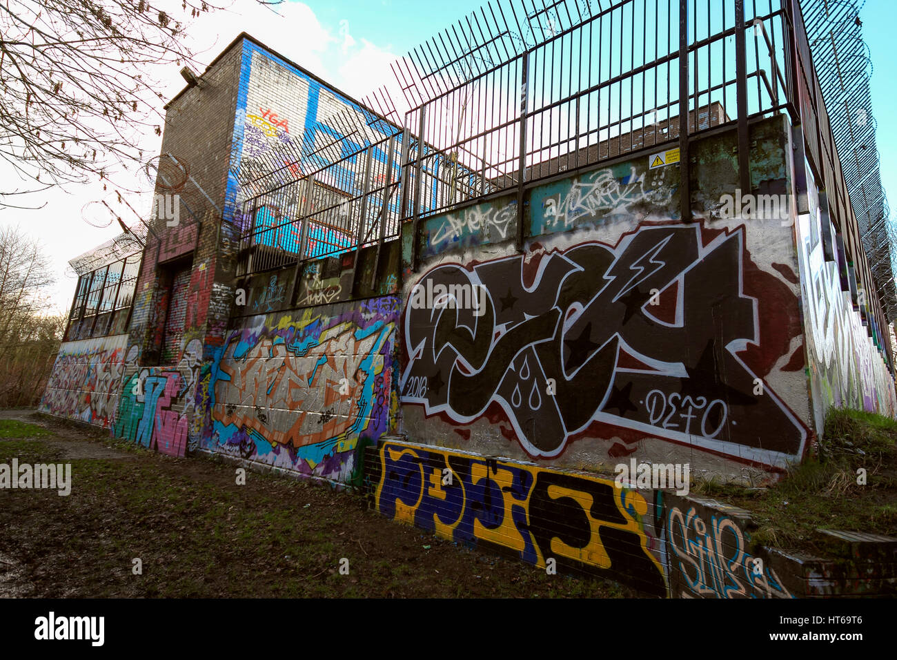 Colourful graffiti on a wall, sewage treatment building, Chorlton Ees ...