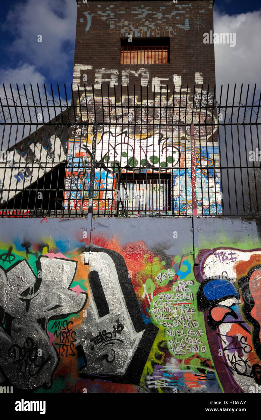 Colourful graffiti on a wall, sewage treatment building, Chorlton Ees ...