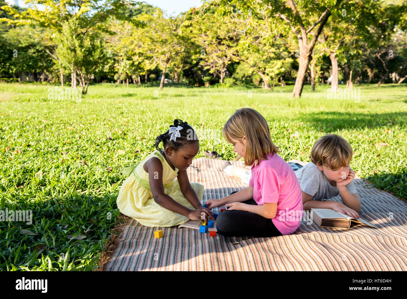 Children Playing Reading Park Outdoors Nature Stock Photo - Alamy