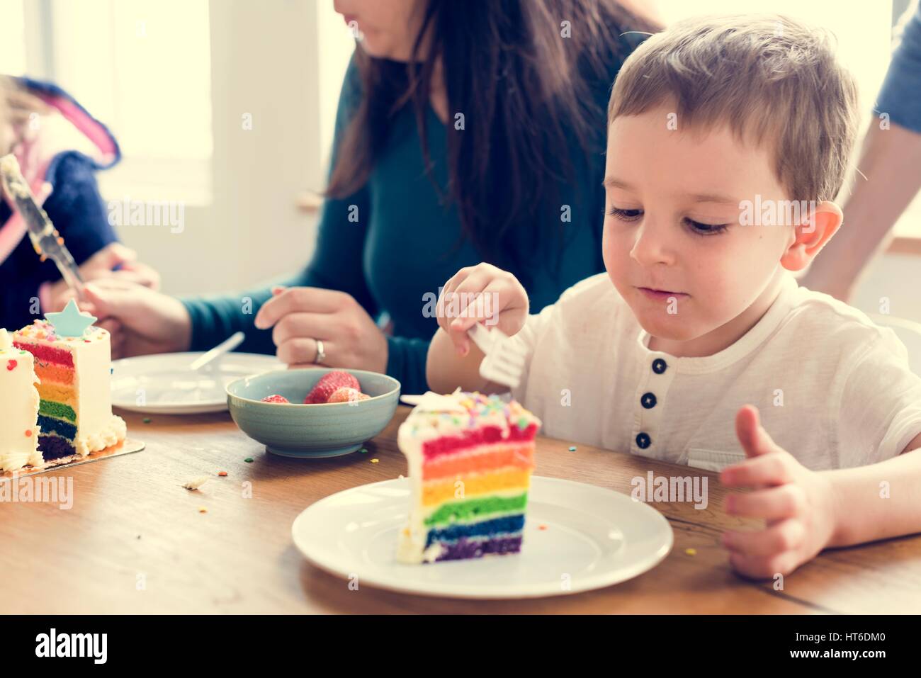 Eating Rainbow Cake Birthday Delicious Stock Photo - Alamy