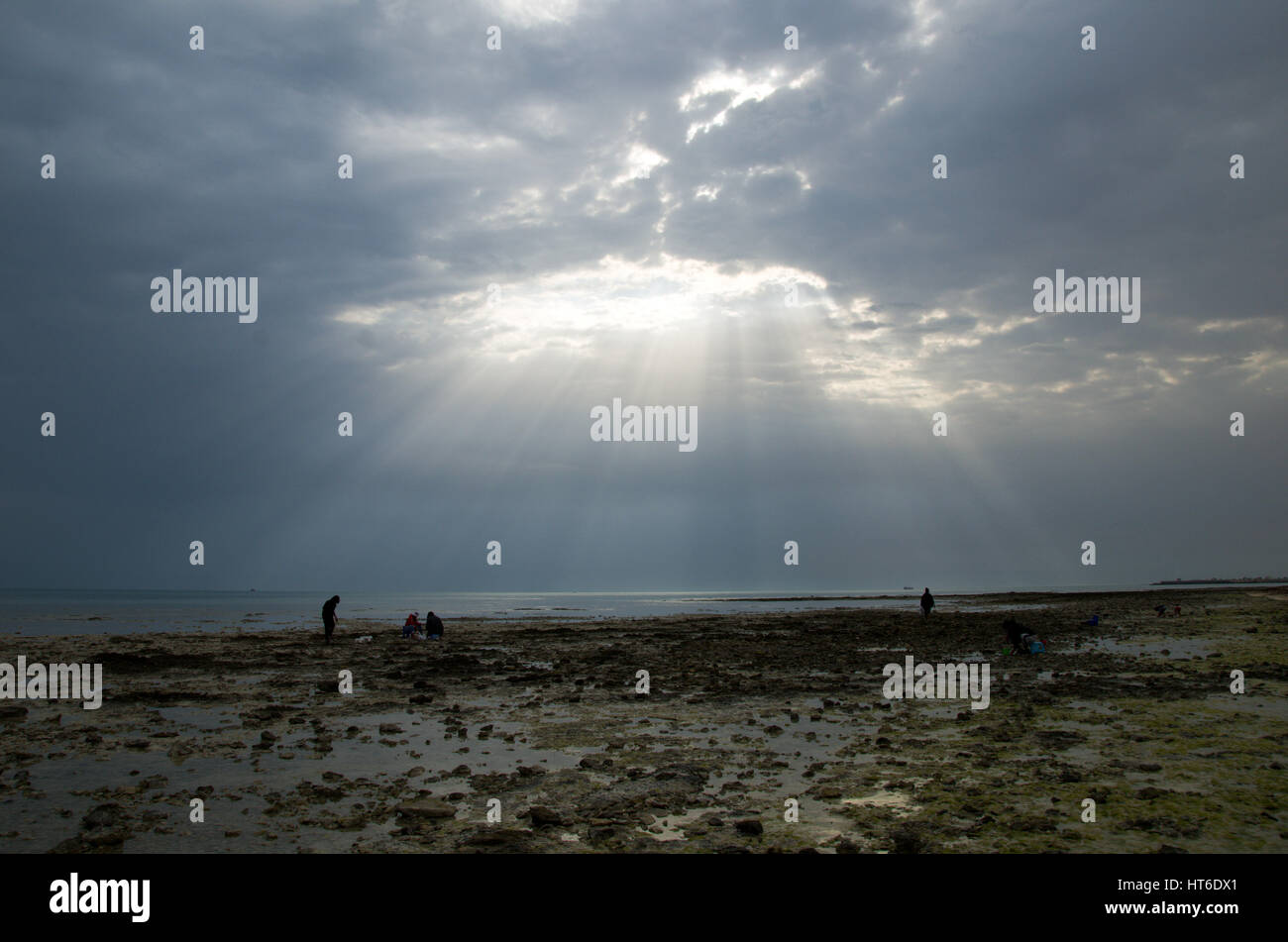Beautiful view of sun rays penetrating through the clouds on the rocky ...