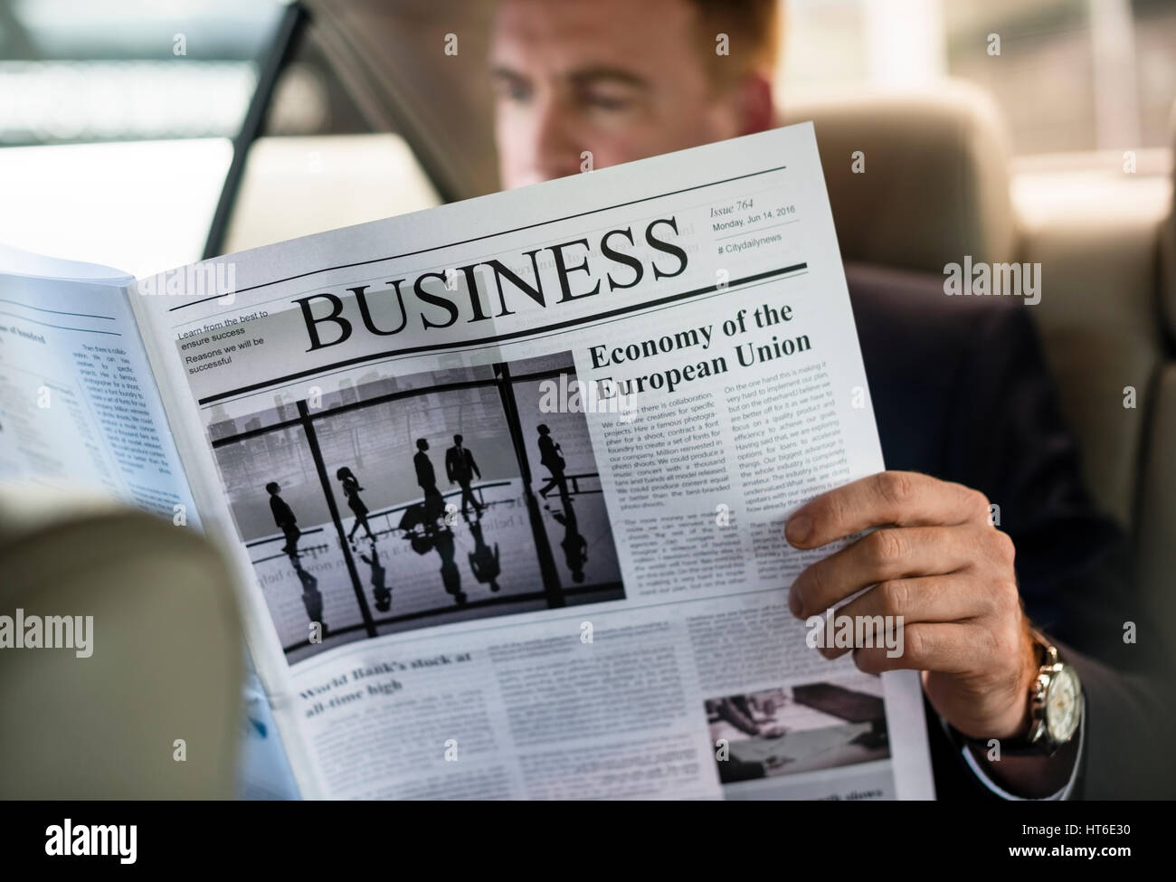 Businessman Reading Newspaper Car Inside Stock Photo - Alamy