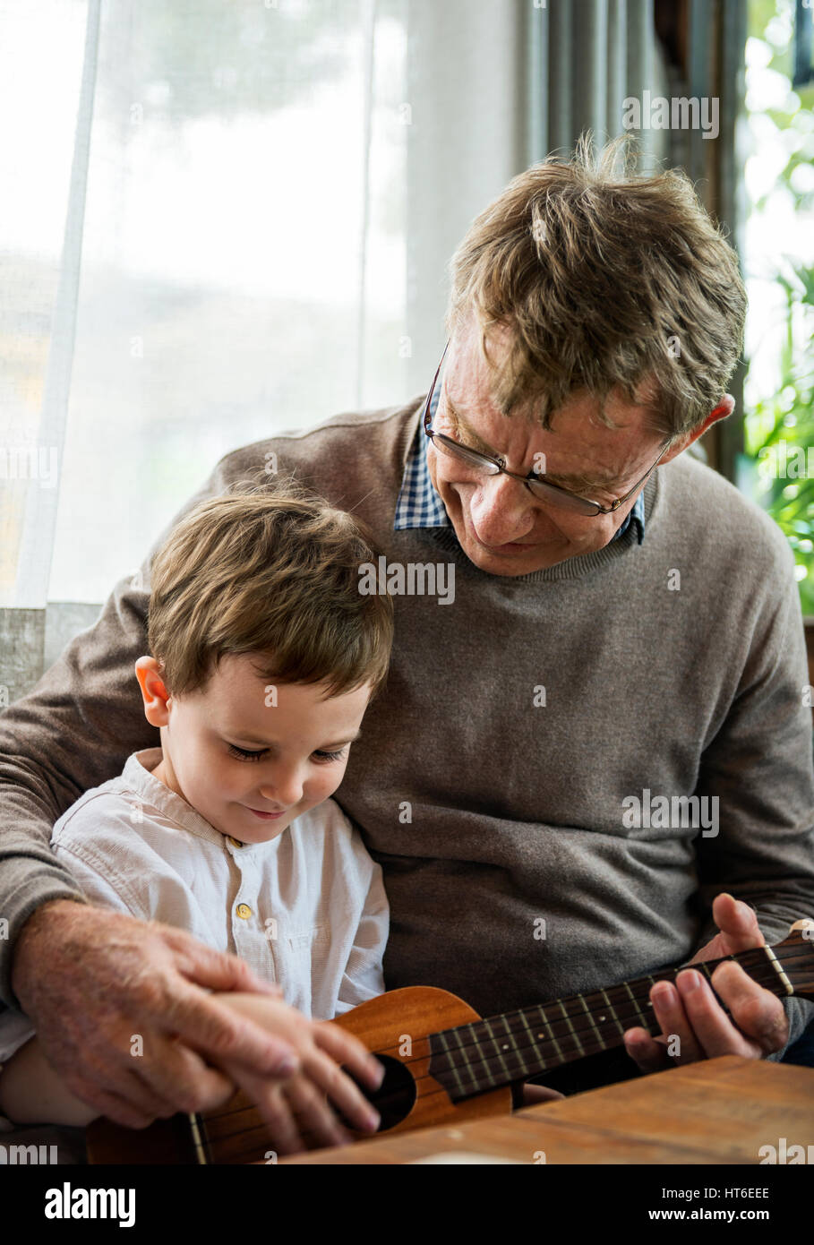 Grandfather grandson music hi-res stock photography and images - Alamy