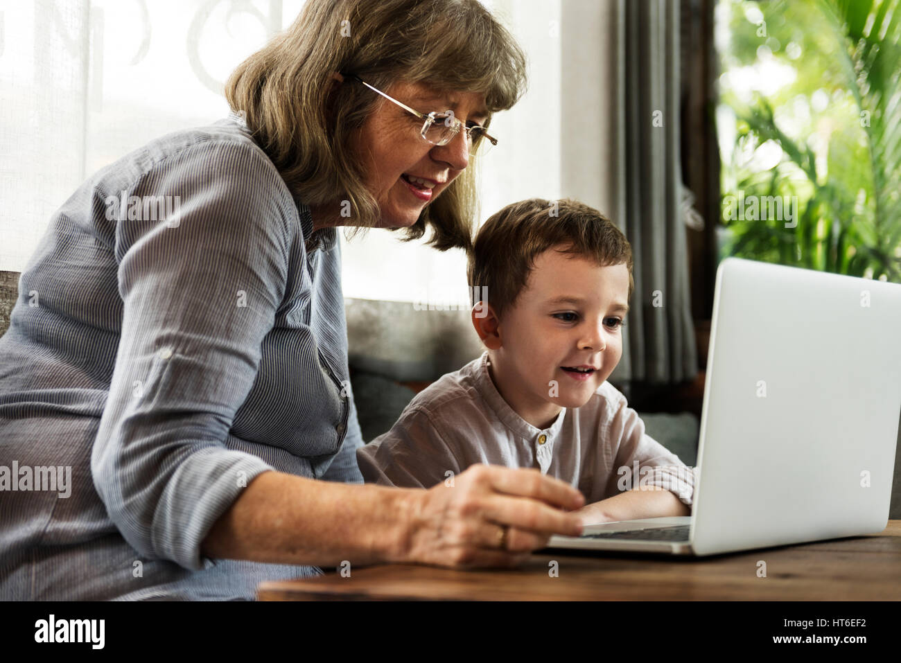 Grandmother grandson laptop hi-res stock photography and images - Alamy