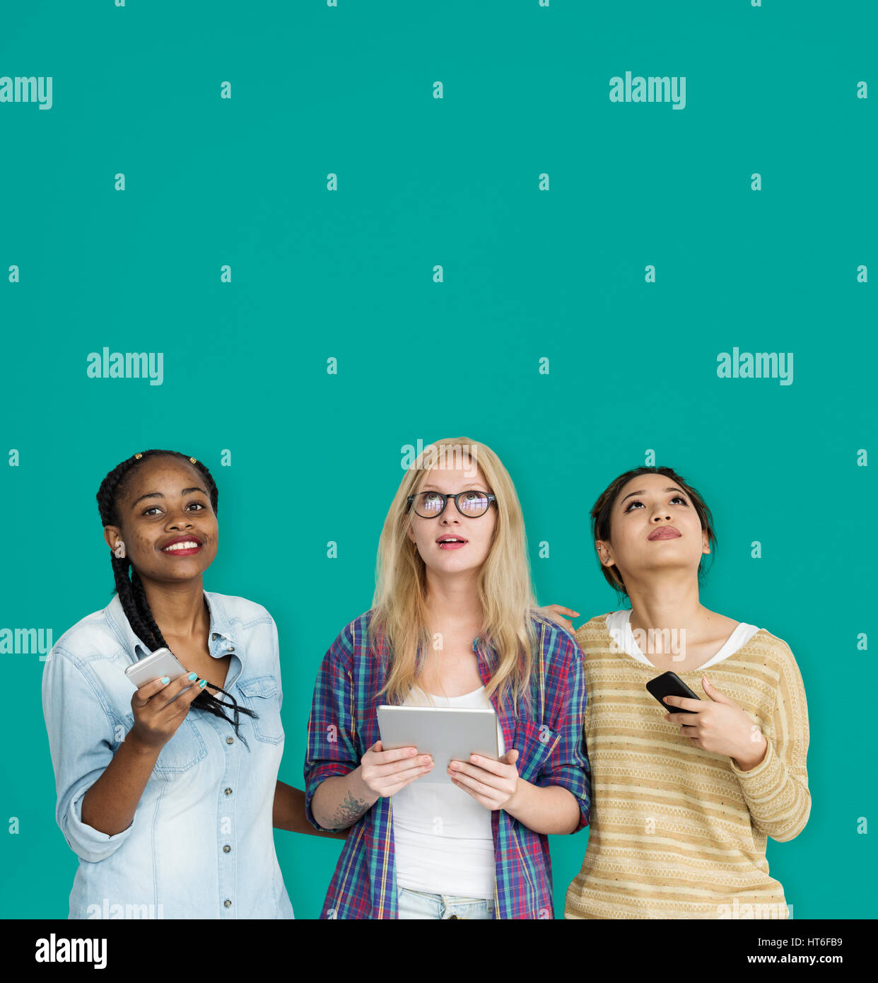 Group of Girls Using Technology Gadgets Stock Photo - Alamy