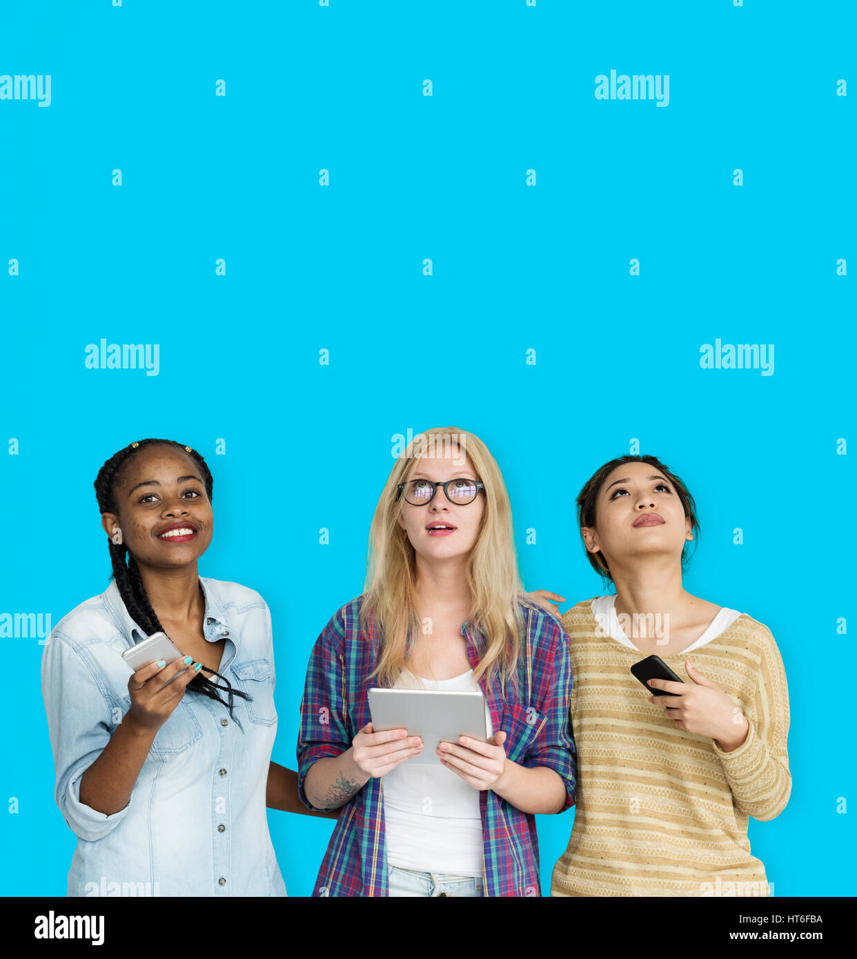 Group of Girls Using Technology Gadgets Stock Photo - Alamy