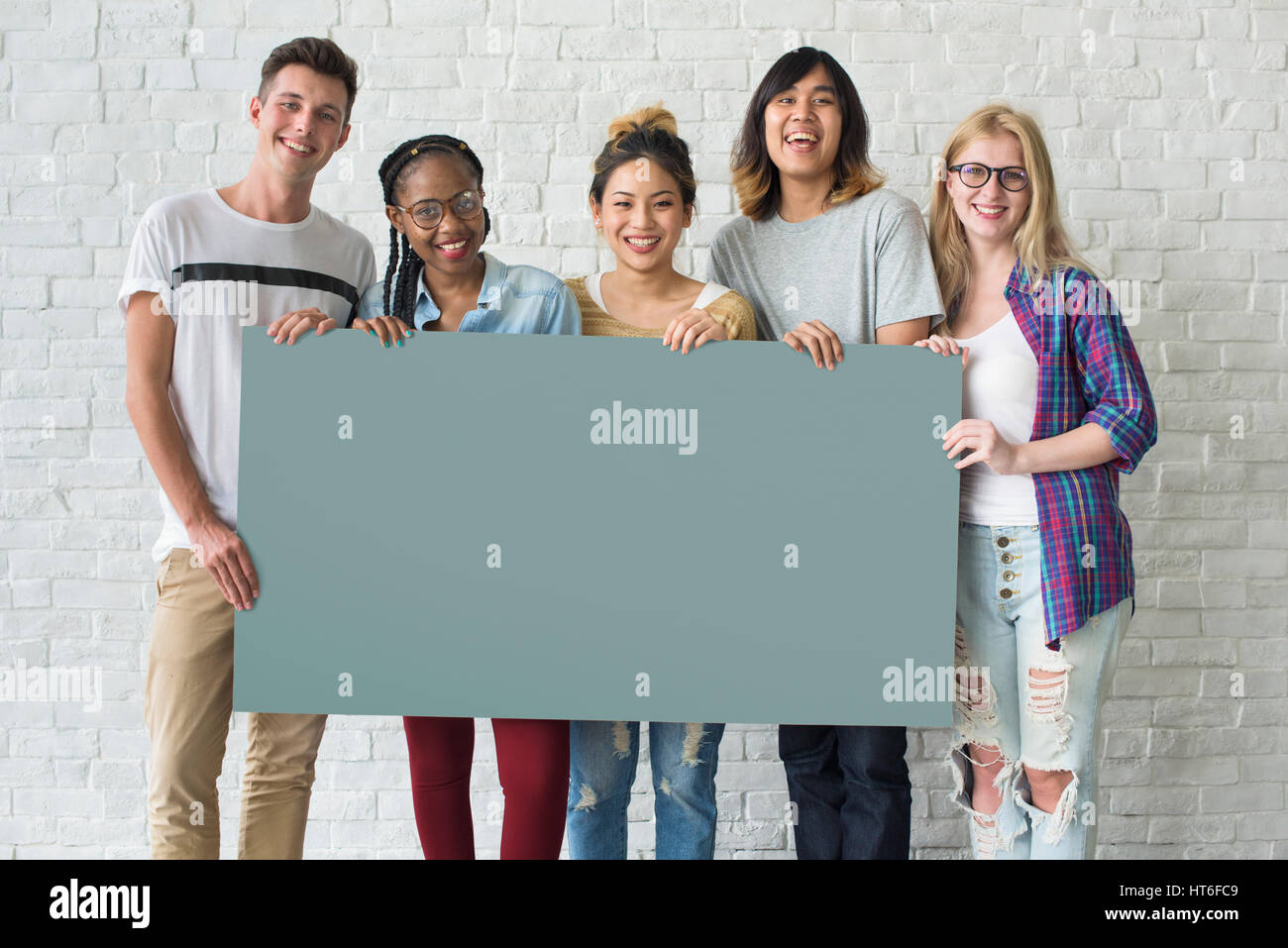 Group of Friends Holding Blank Banner Stock Photo - Alamy