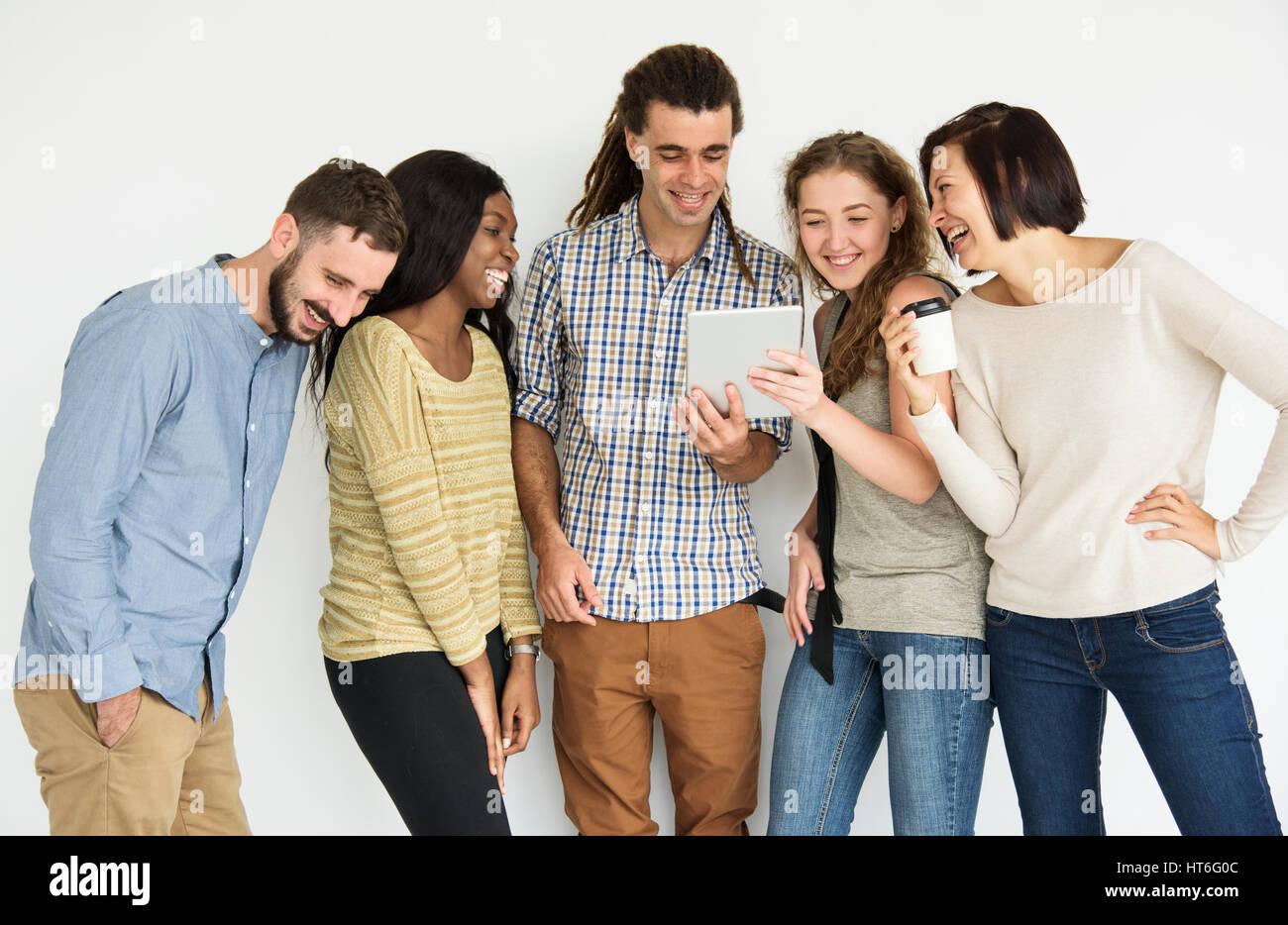 Diverse group of people using tablet Stock Photo - Alamy