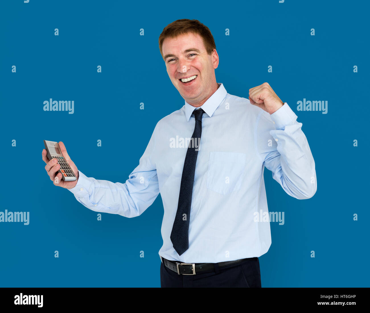 Caucasian business man calculator smiling hi-res stock photography and ...