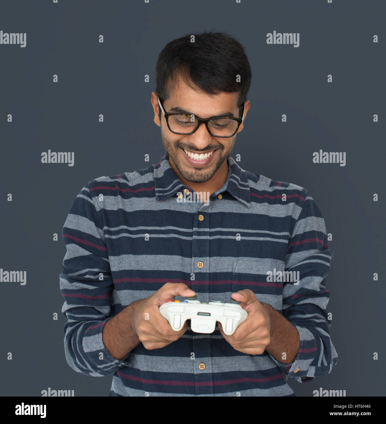 Indian man game controller hi-res stock photography and images - Alamy