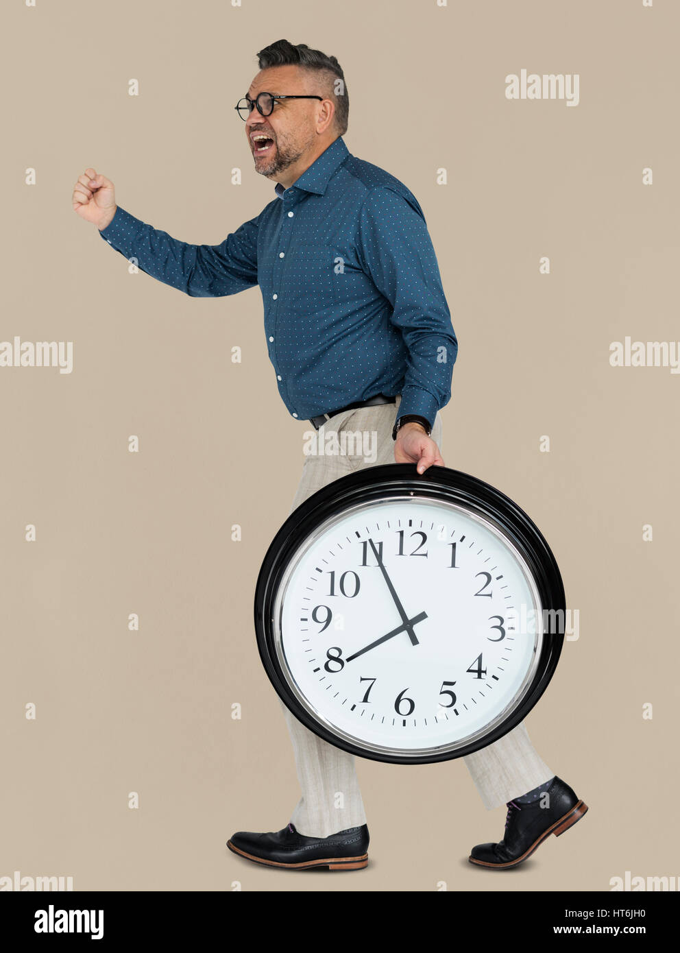 Caucasian Man Rushing Clock Stock Photo - Alamy