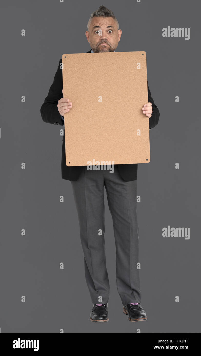 Caucasian Business Man Holding Board Stock Photo - Alamy