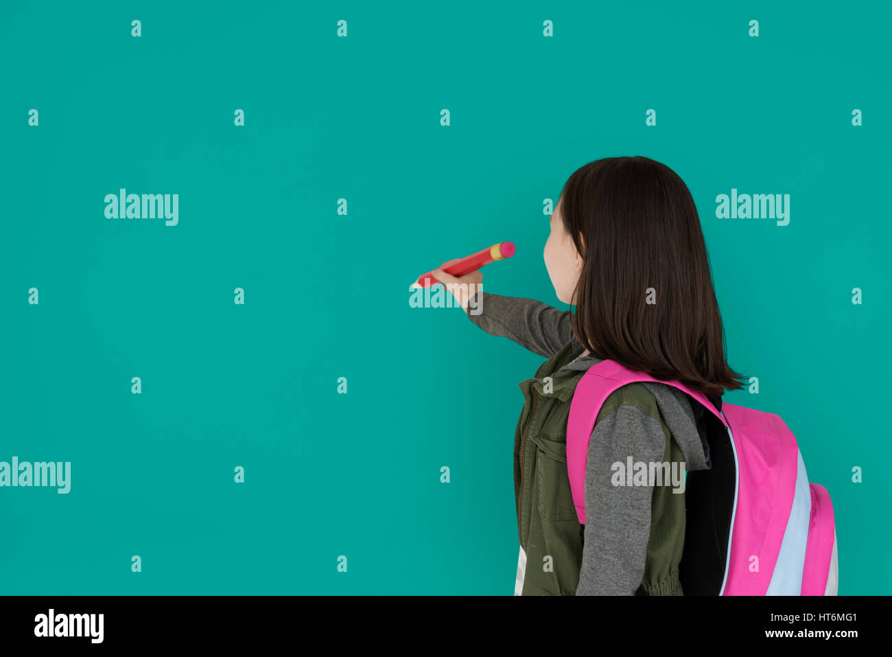 Little Girl Holding Pencil Back View Stock Photo - Alamy