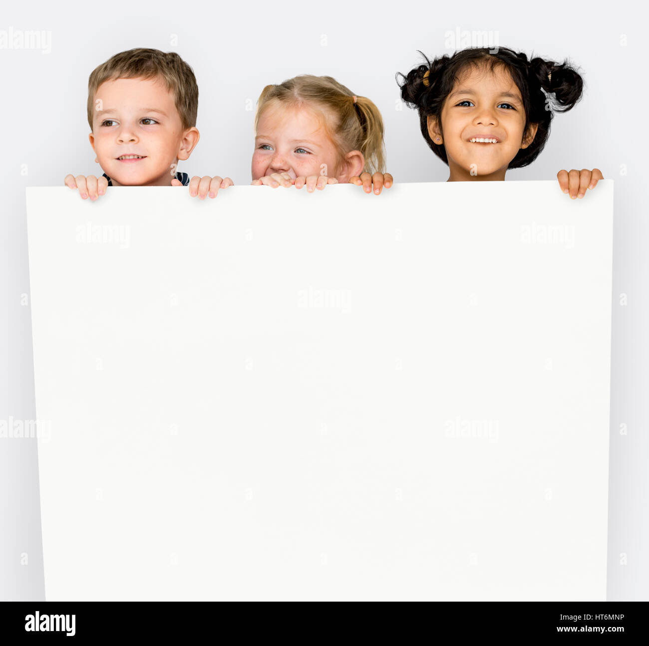Little Children Holding Empty Paper Smiling Stock Photo - Alamy