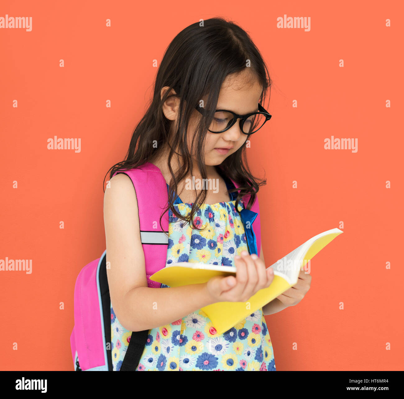 Little Girl Reading Book Focusing Stock Photo - Alamy