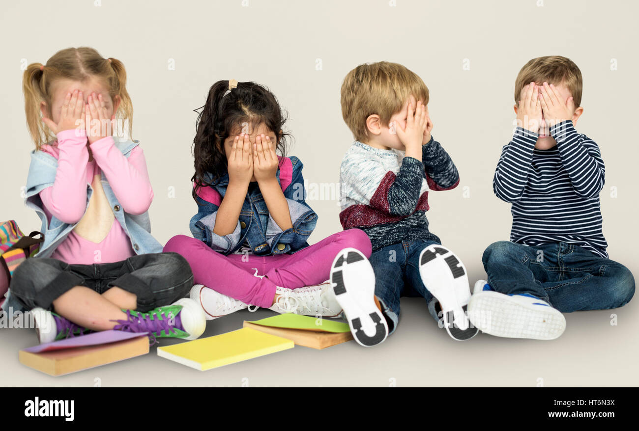 Little Children Peek-A-Boo Covering Face Stock Photo - Alamy