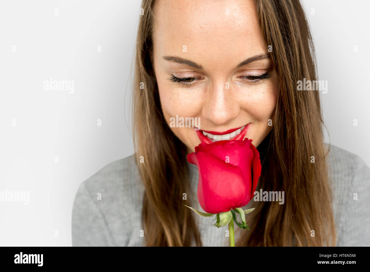 Young Lady Hugging Rose Smiling Stock Photo - Alamy