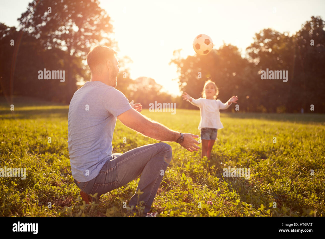 Father and daughter playing ball hi-res stock photography and images ...
