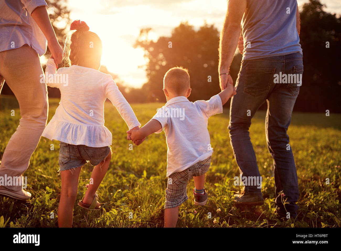 Happy family together outdoor back view- concept Stock Photo - Alamy