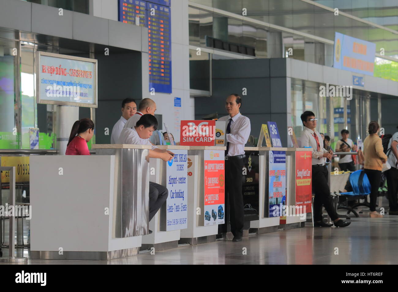 People work at travel service desk Ho chi Minh City International ...
