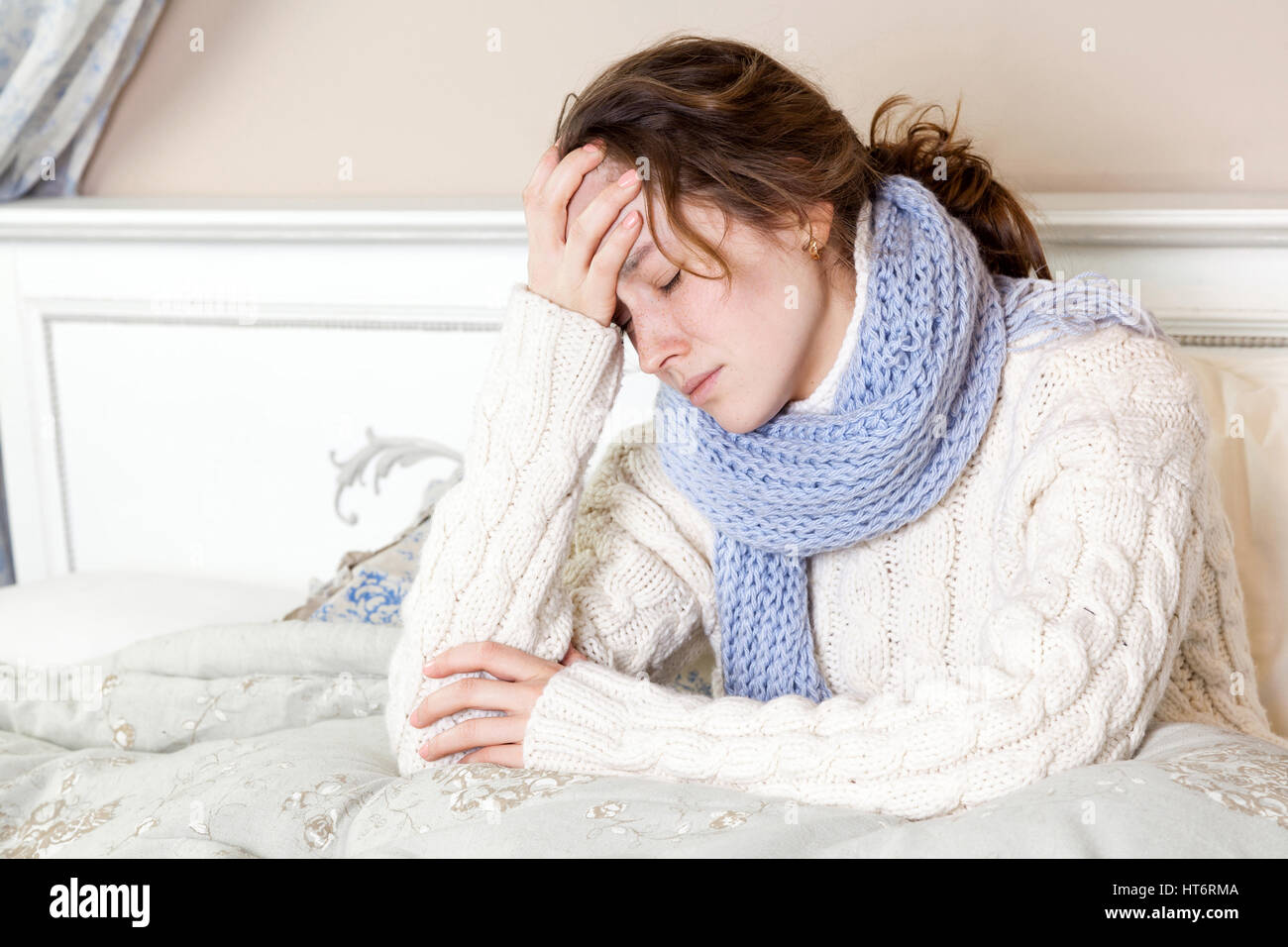 Flu or cold. Closeup top view image of frustrated young woman with blue ...