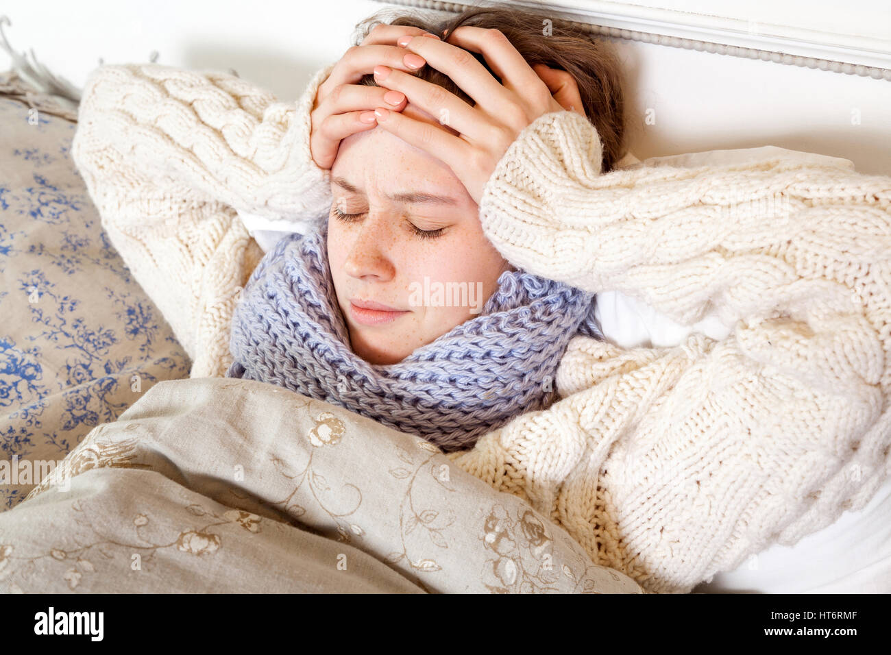 Flu or cold. Closeup top view image of frustrated young woman with blue ...