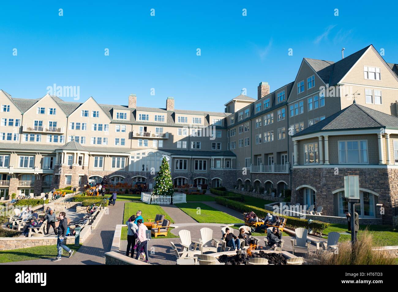 People gather outside the Ritz Carlton Half Moon Bay hotel, Half Moon ...