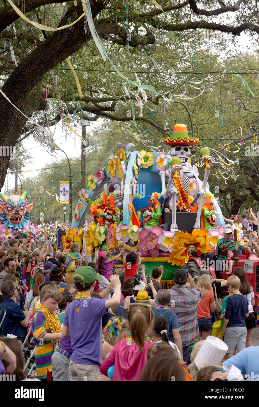 A parade float with crowd of revelers on Mardi Gras day in New Orleans ...