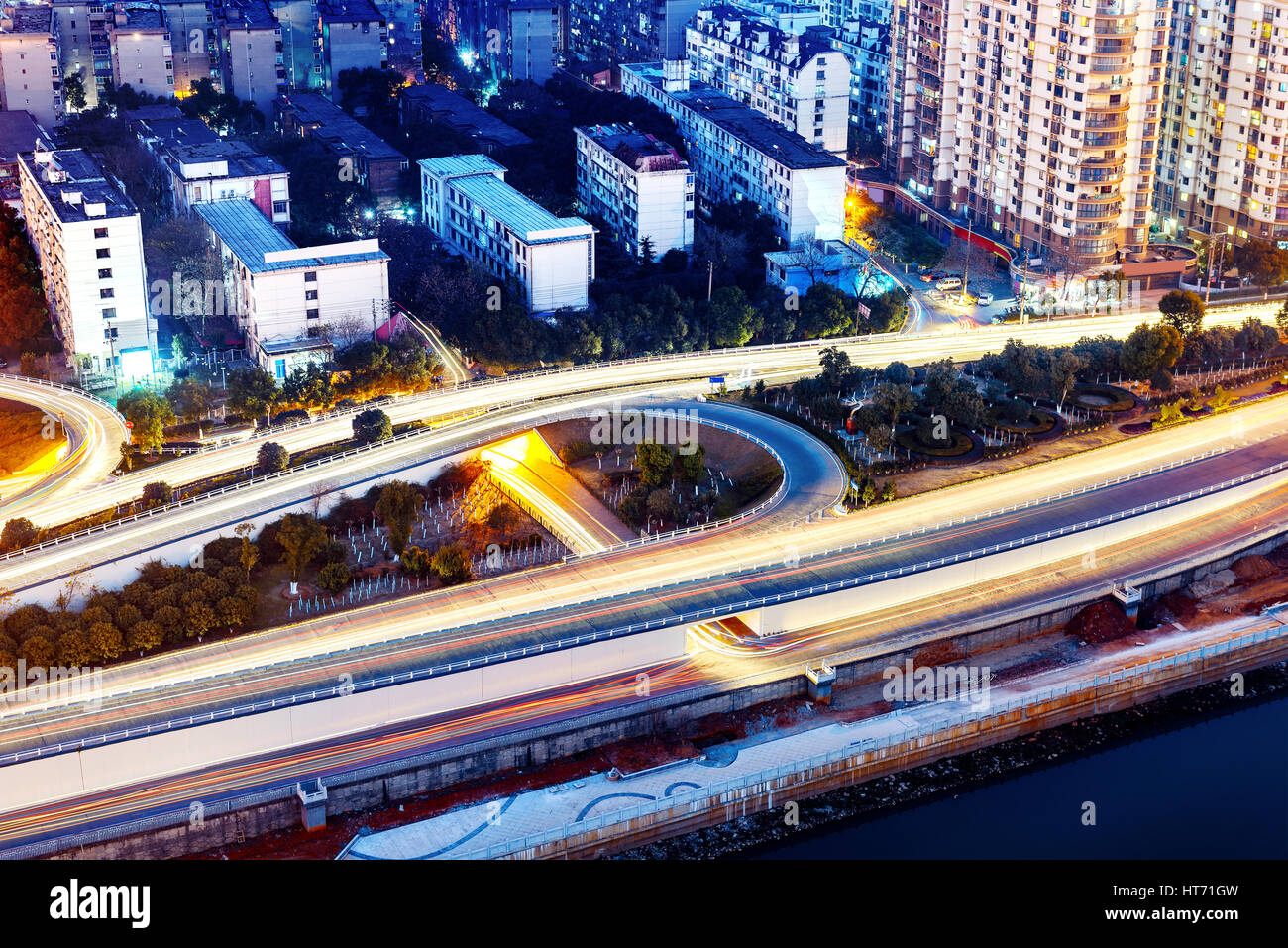 Freeway in night with cars light in modern city Stock Photo - Alamy