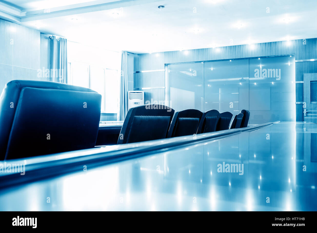 Luxurious meeting room with tables and chairs, blue tones Stock Photo ...