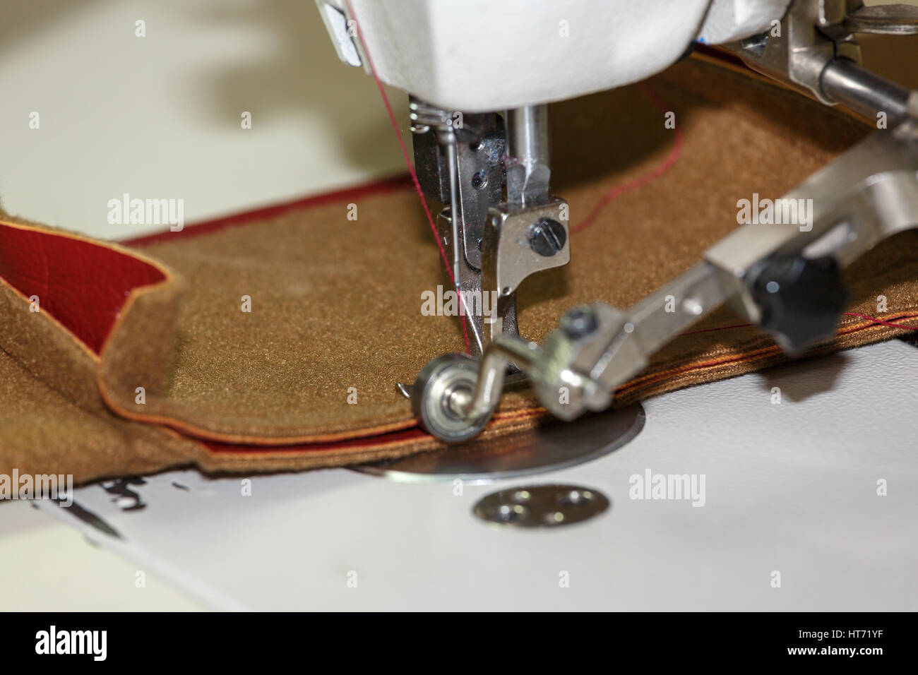 Hands of woman who work on sewing machine with textile Stock Photo - Alamy
