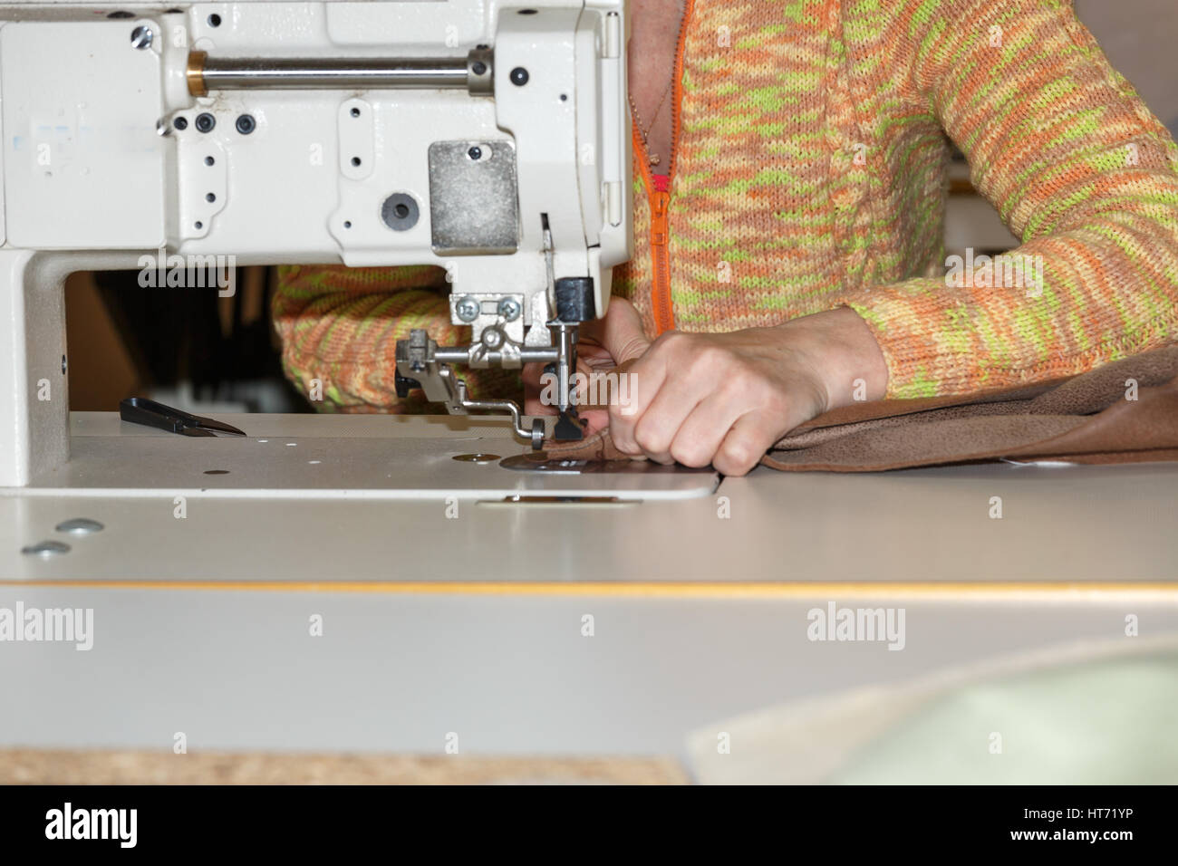 Hands of woman who work on sewing machine with textile Stock Photo - Alamy