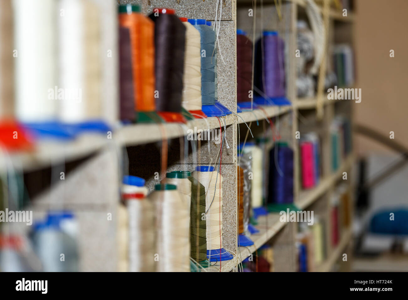 Colored thread on a shelf Stock Photo - Alamy