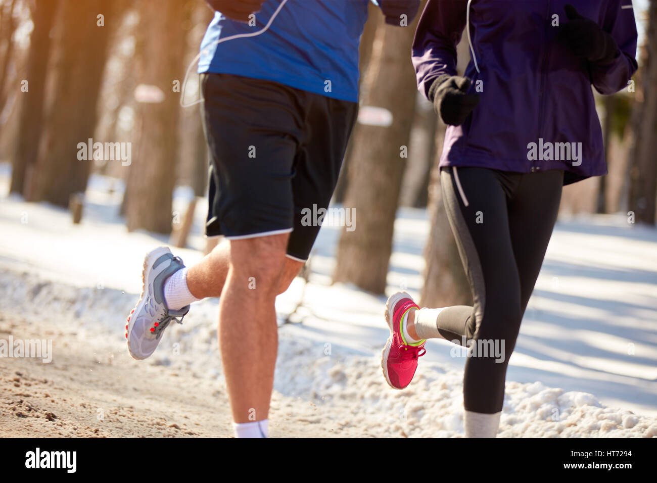 Legs of runners couple while runs, concept Stock Photo - Alamy