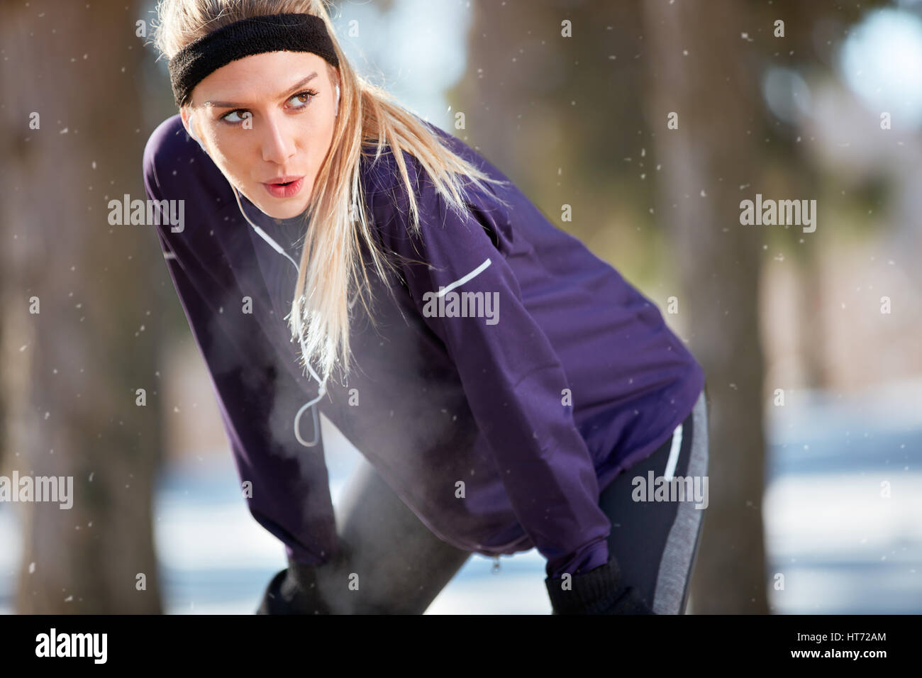 Breathless girl make short break from running Stock Photo - Alamy