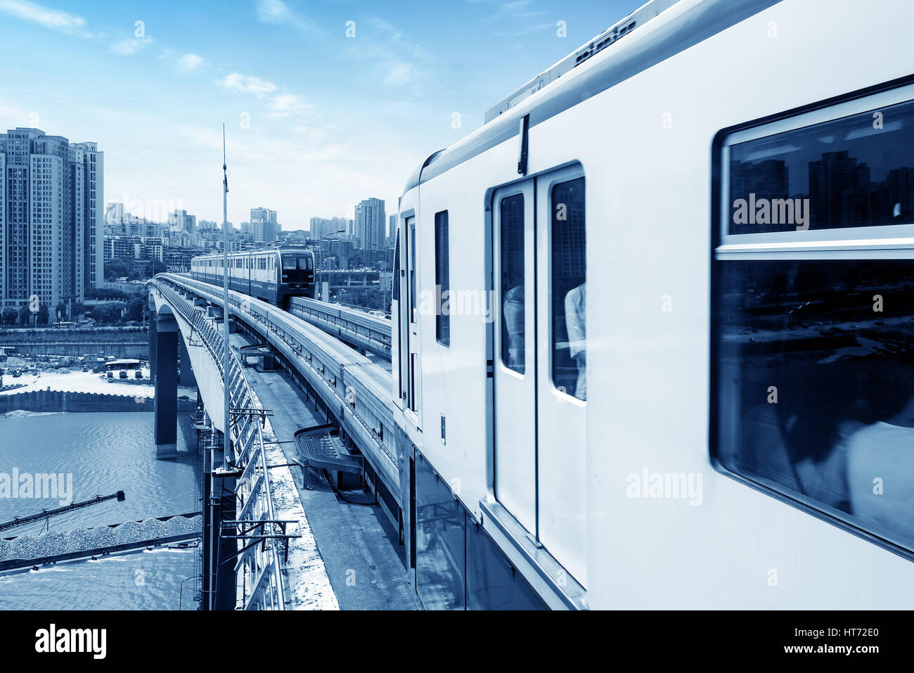 light rail moving on railway in chongqing Stock Photo - Alamy