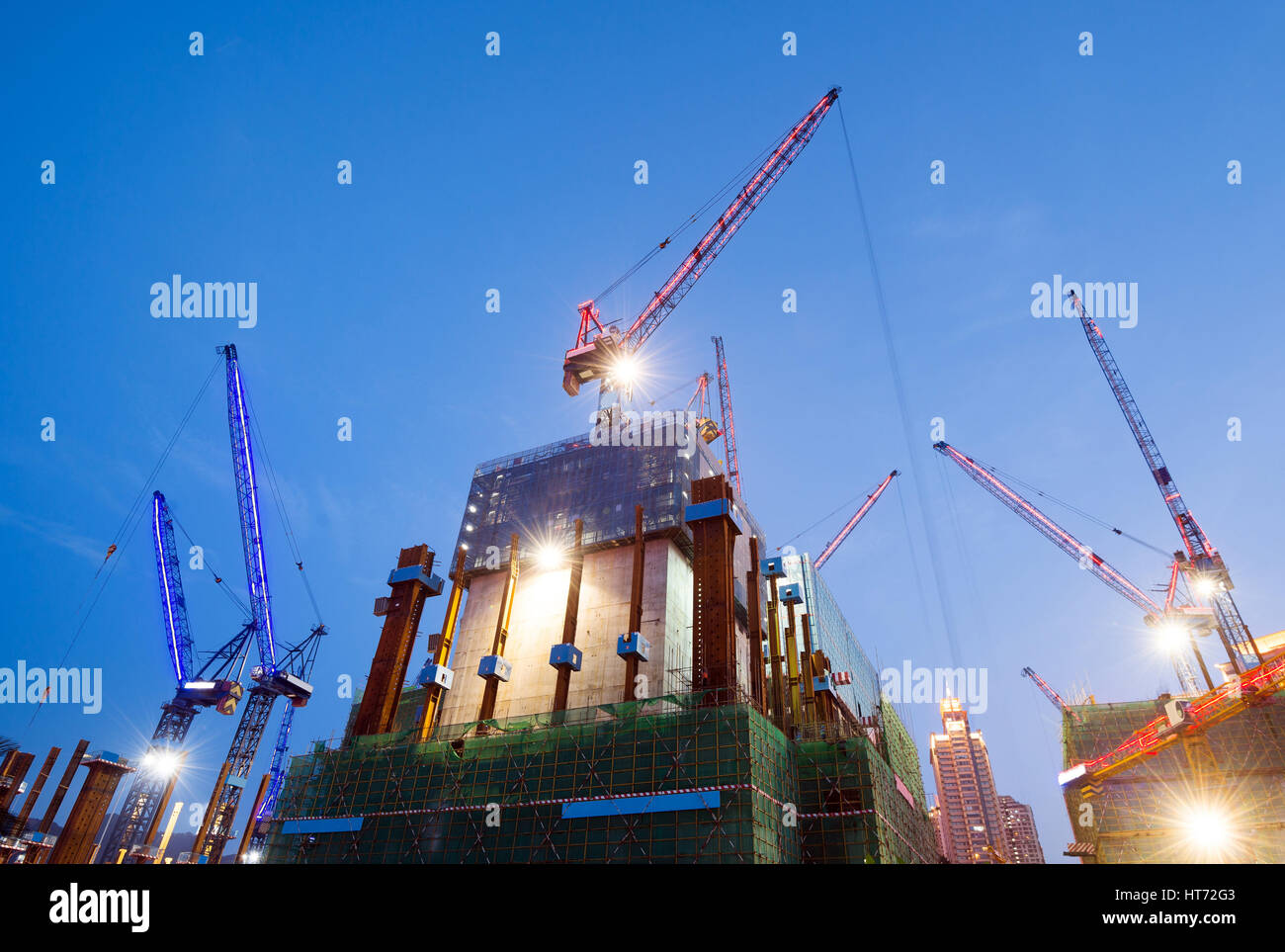 Construction at night with lights against the dark sky Stock Photo - Alamy