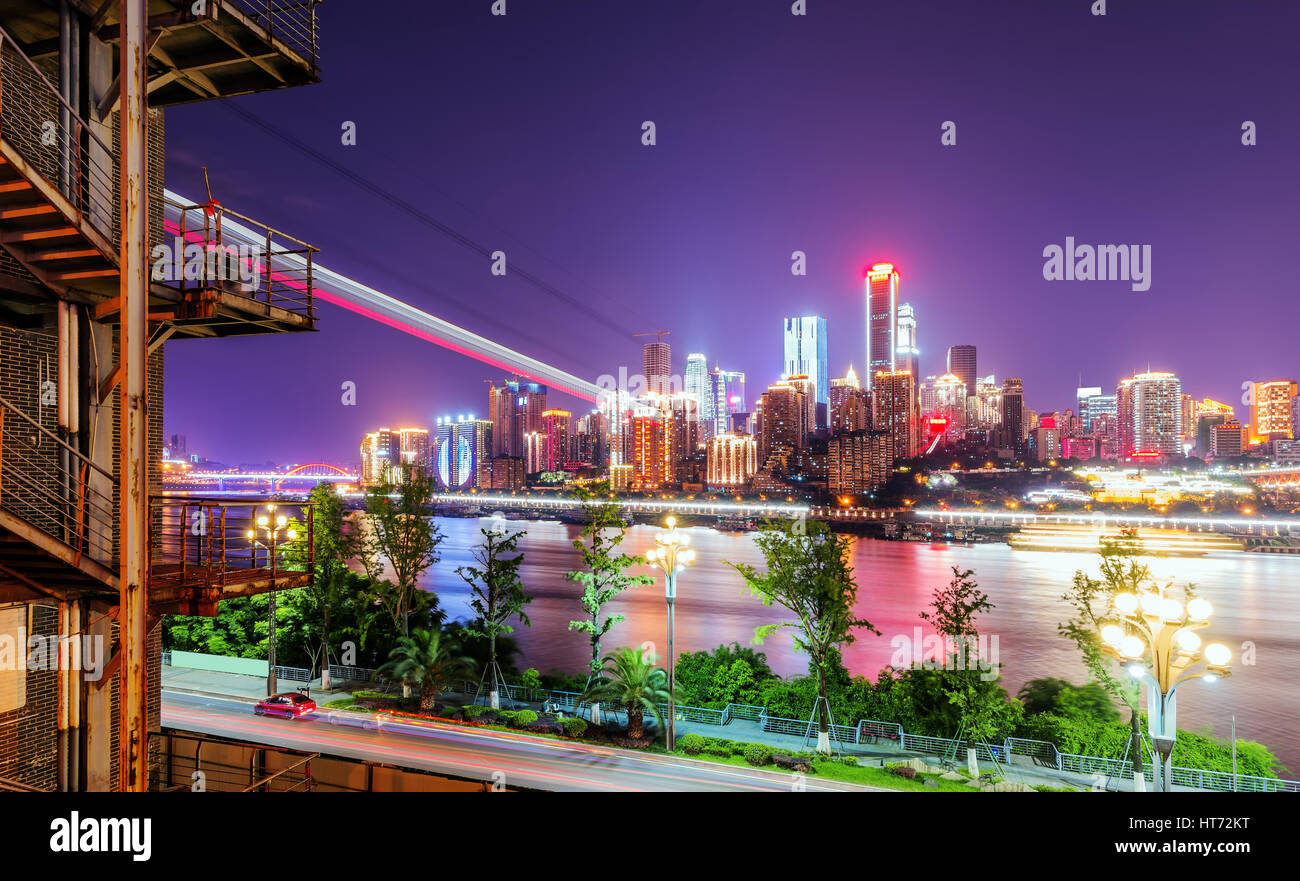 Night view of the city in the Yangtze River, the cable trail across the ...