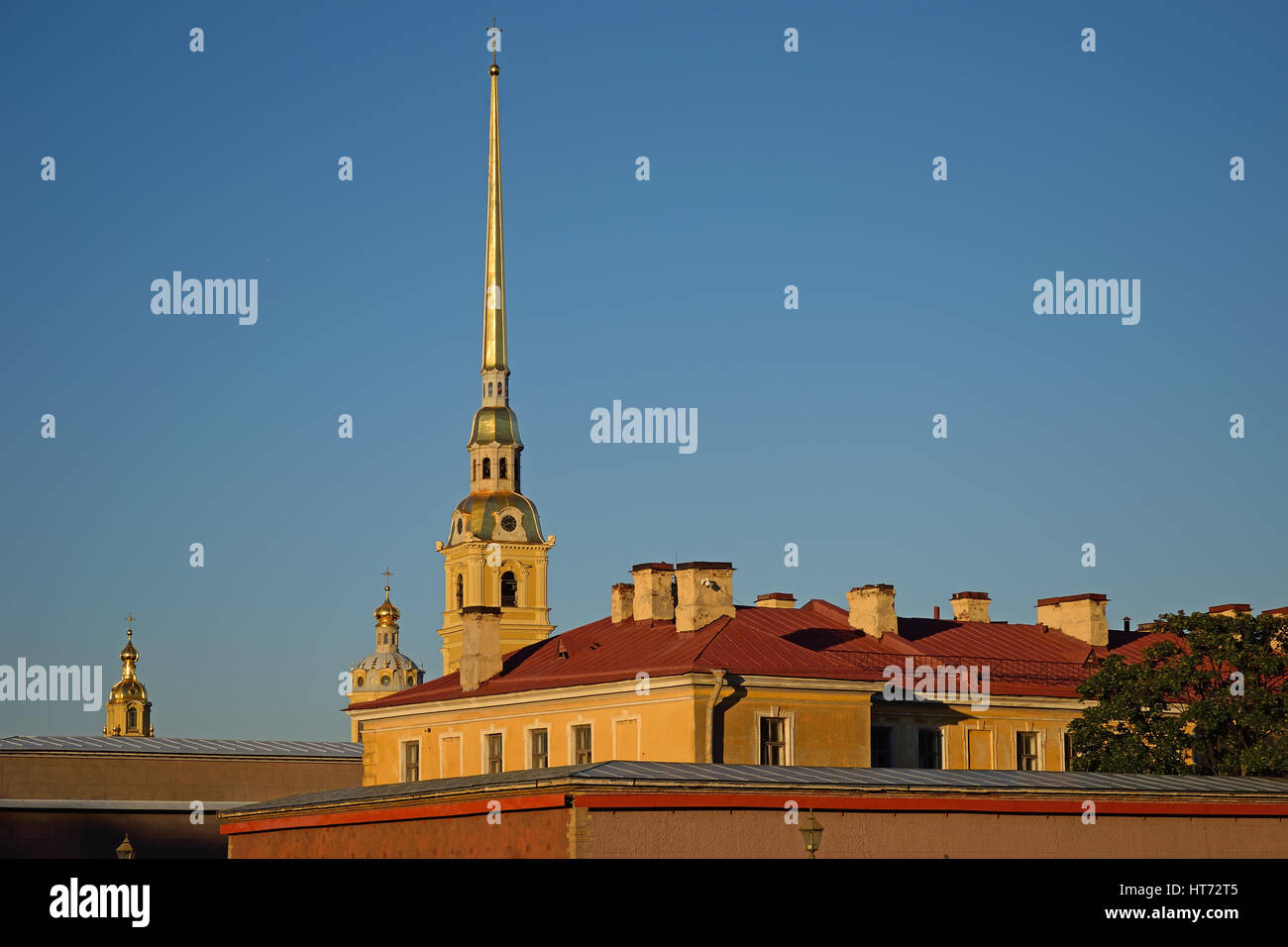 The bell tower of Peter and Paul Cathedral fortress on Hare island in St. Petersburg over the ...
