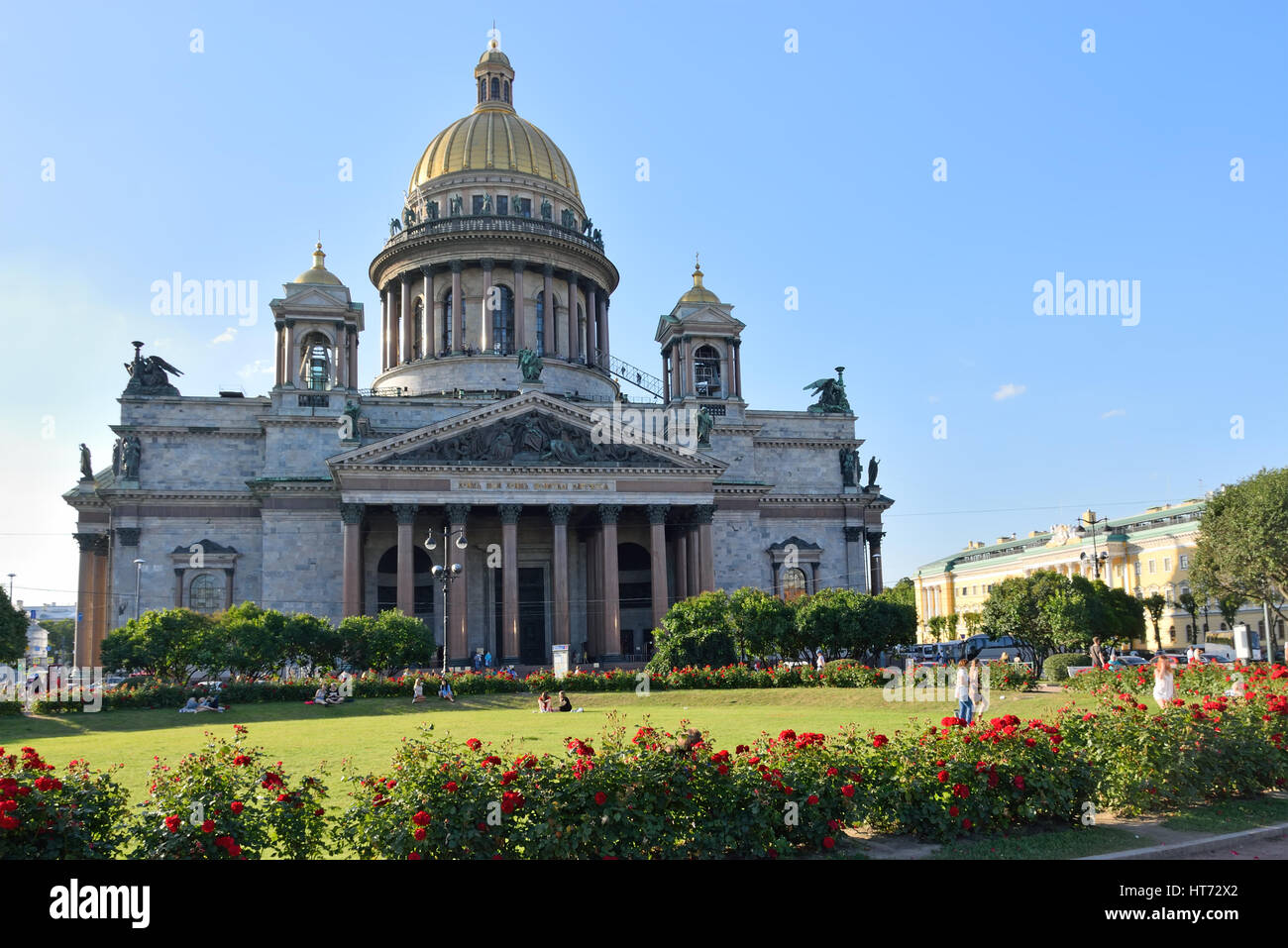 St. Isaac's Cathedral on a background of red roses on the square bright ...