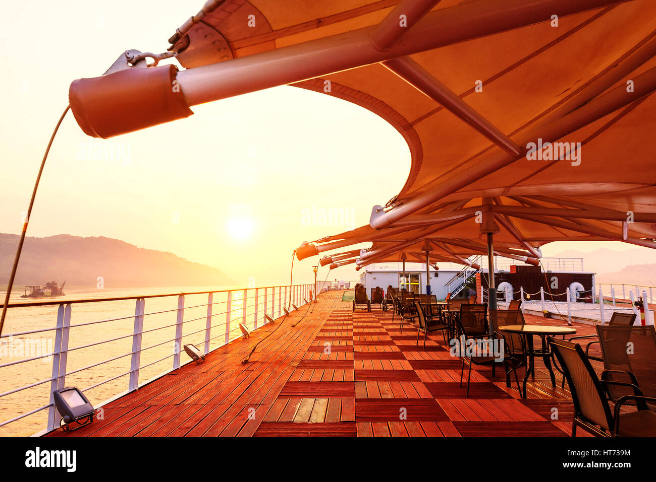 Cruise ship deck, morning sun shines on the floor, a piece of red Stock ...