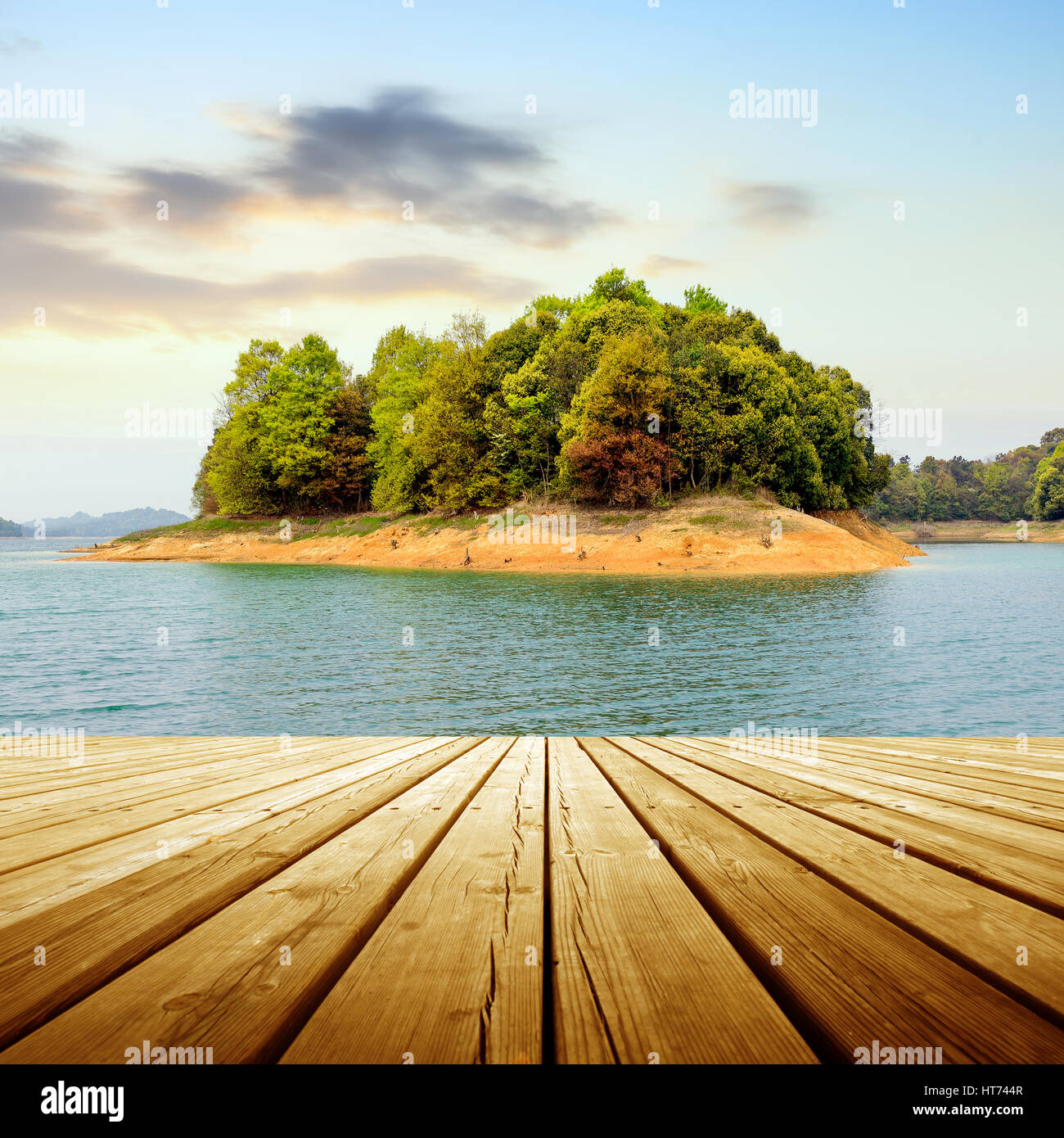 Seaside wooden platforms and islands, dusk landscape Stock Photo - Alamy