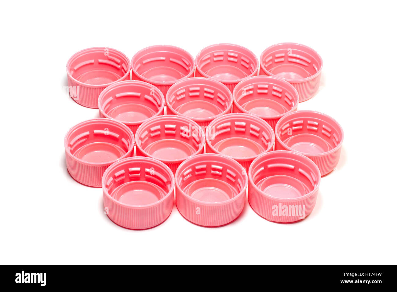 Pink plastic bottle caps isolated on white background Stock Photo - Alamy