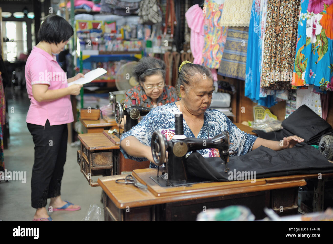 CHACHOENGSAO, THAILAND - JUNE 21, 2014: An unidentified old dressmakers ...