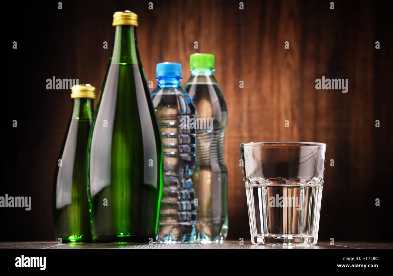 Composition with glass and bottles of mineral water Stock Photo - Alamy