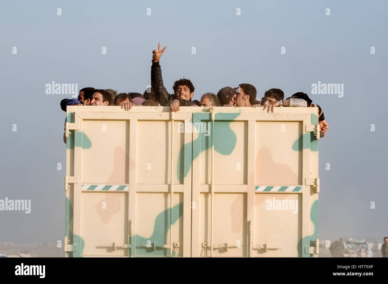 Refugees fleeing fighting in Iraqi army trucks during operations to ...